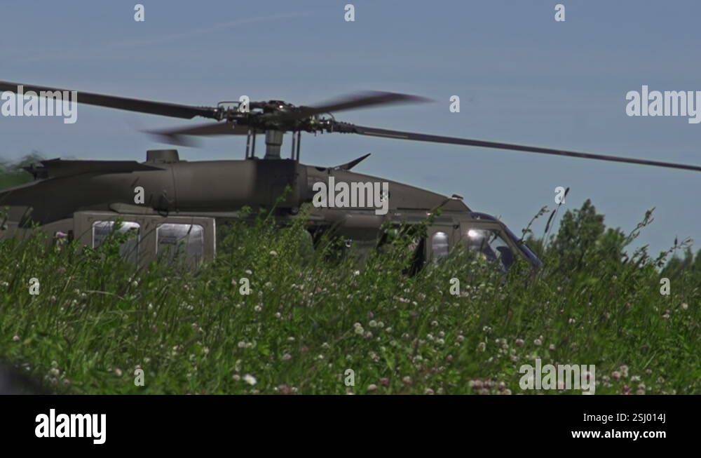 Sikorsky UH-60 Black Hawk Taxiing Past Tall Grass With Main Rotor ...