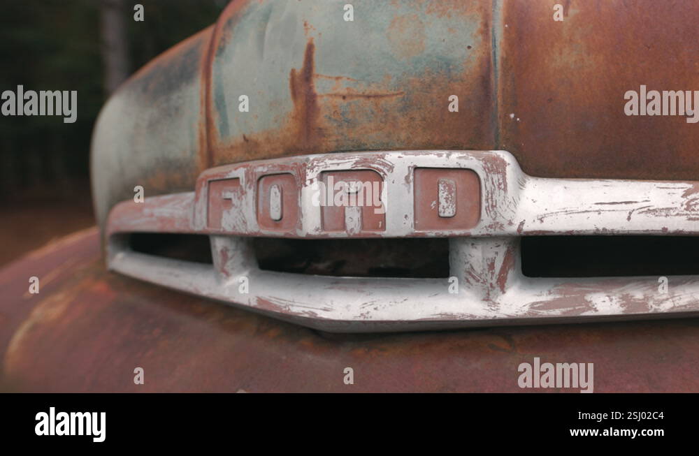 A rotting and rusty old ford truck forgotten in a junk yard Stock Video ...