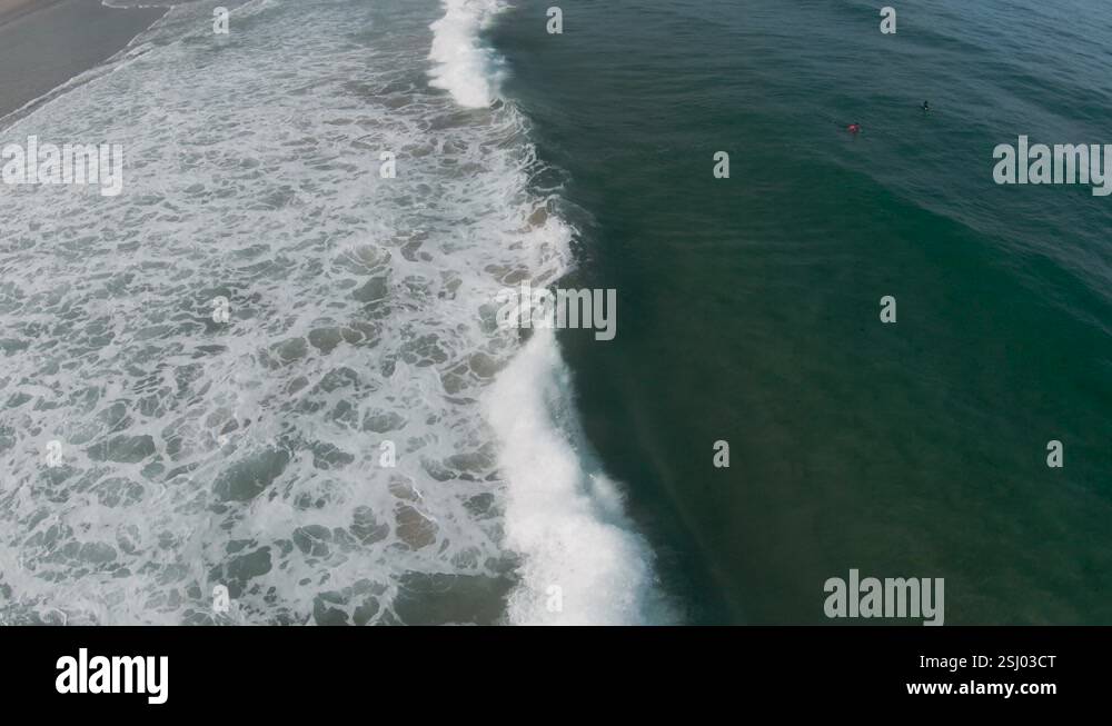 Powerful ocean waves crash in impact zone as ocean spray dances off the ...