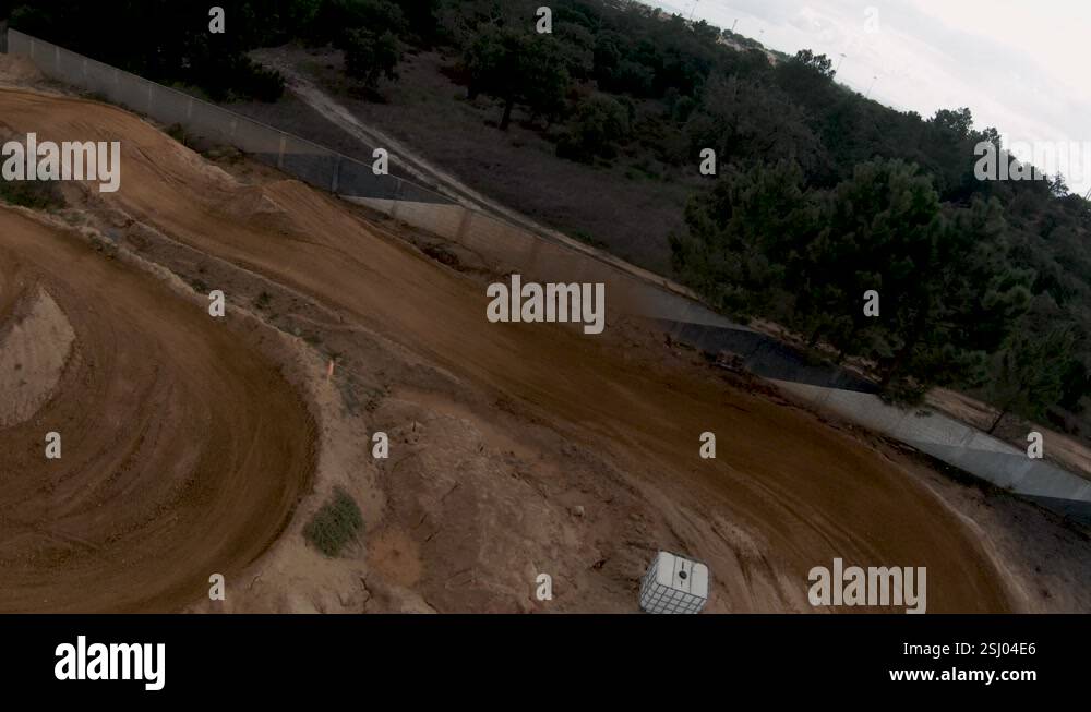 FPV drone rounds motocross dirt track banked turn Stock Video Footage ...