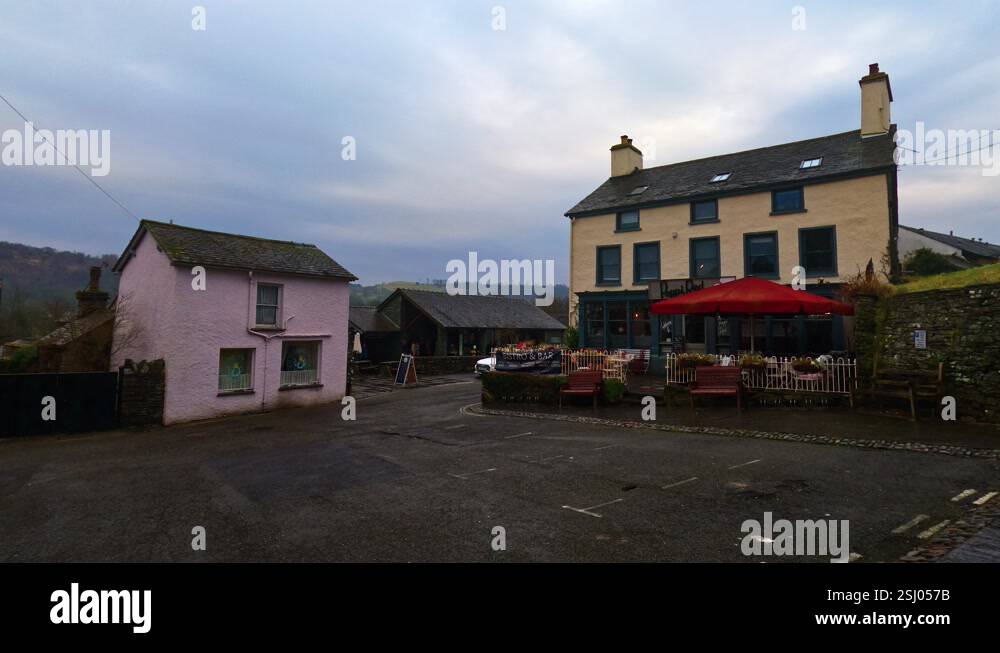 Busy Cumbrian town of Hawkshead. UK. Showing tourists walking around ...