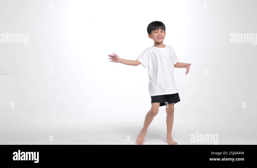 Asian kid practice dancing on the white screen Stock Video Footage - Alamy