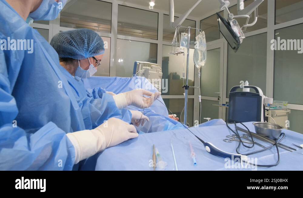 The work of a surgeon with modern medical devices. Stomach surgery and ...