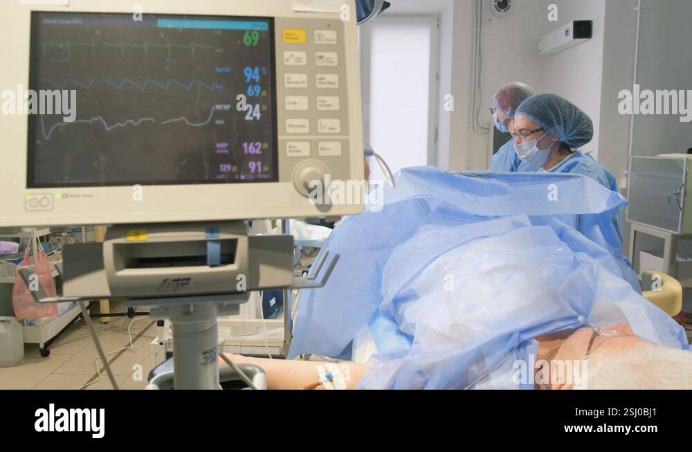 The doctor operates on an elderly woman and performs a surgical ...