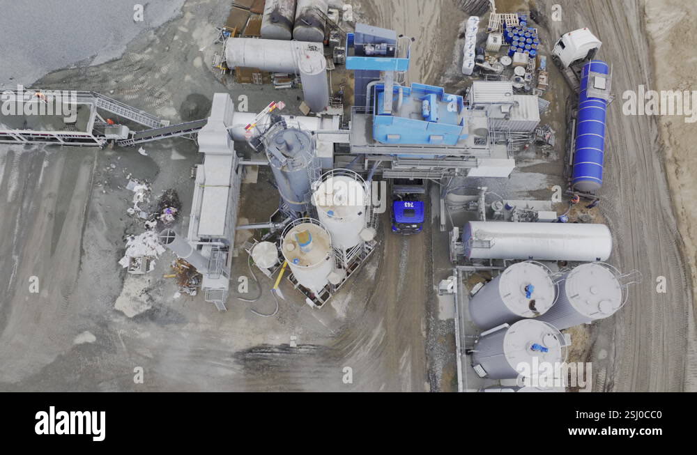 Loading asphalt mix in lorry from processing line at quarry Stock Video ...