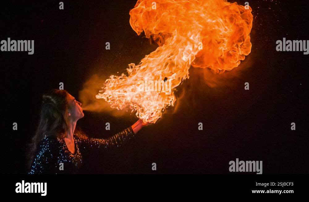 Woman breathing fire in slow motion Stock Video Footage - Alamy