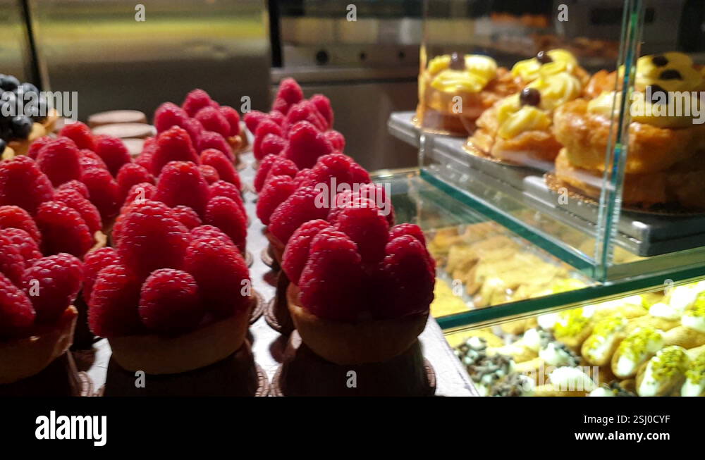 Blueberry rapsberry pile on custard tart beautiful bakery window ...