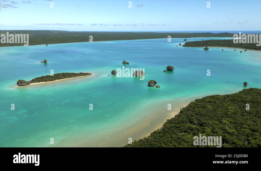 Small island, floating rocks in famous Upi Bay, Isle of Pines. Aerial ...