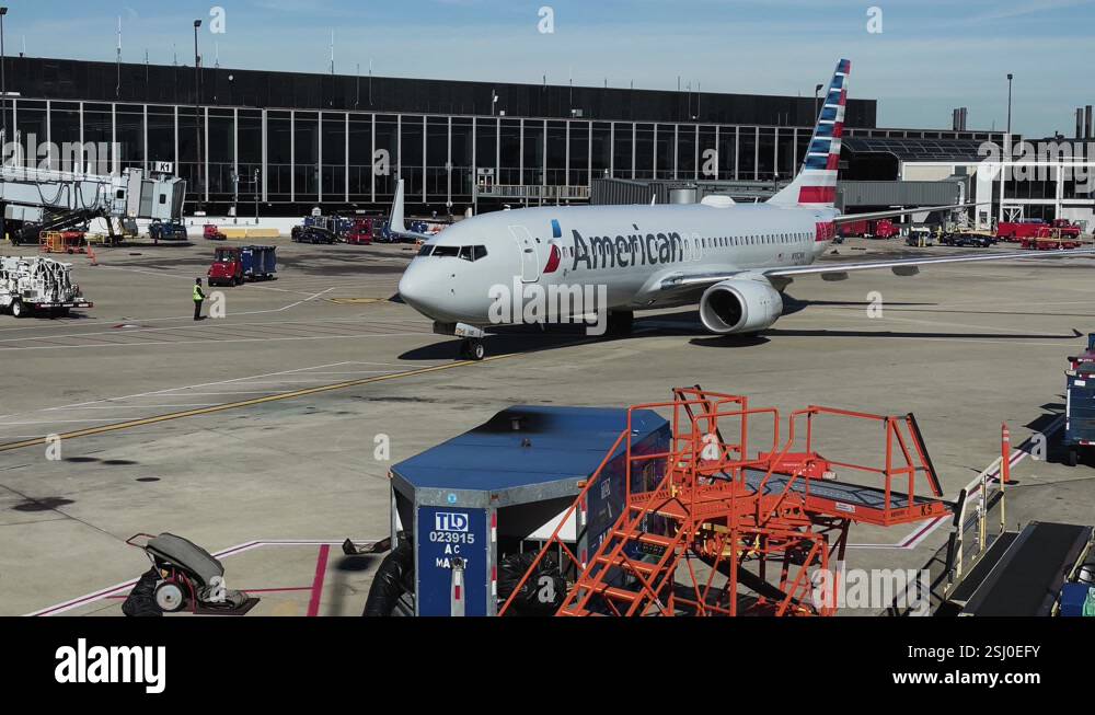 American airlines plane arriving at the boarding gate Stock Video ...