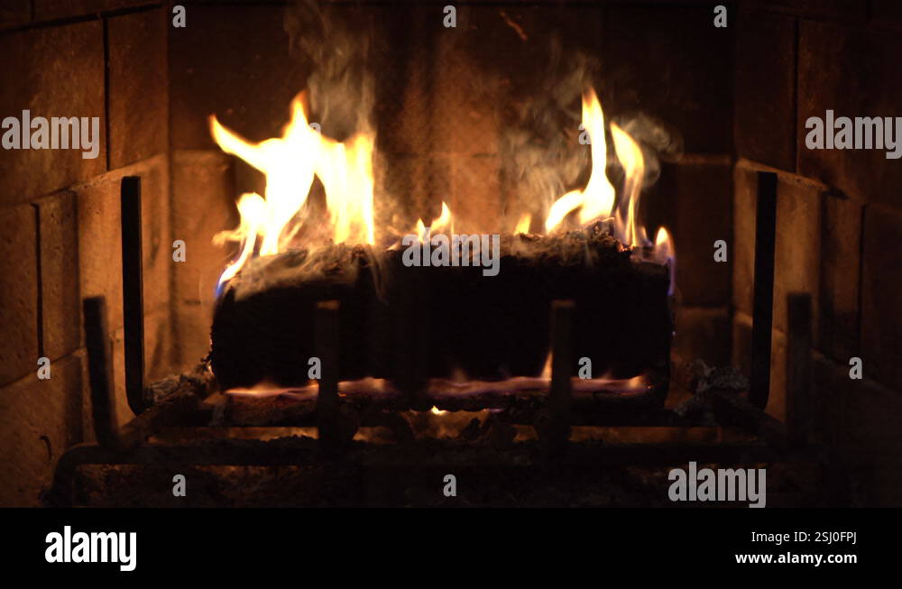 Cozy Fireplace with wax log close up Stock Video Footage - Alamy