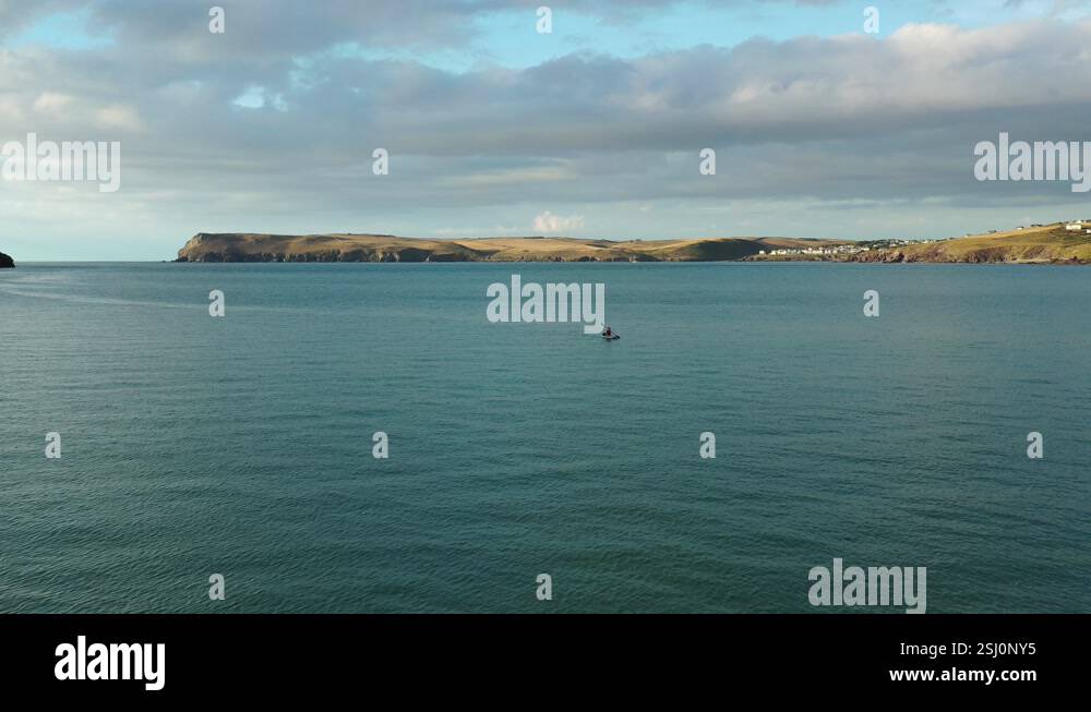 Aerial of woman and young girl kayaking on paddle board in the Camel ...