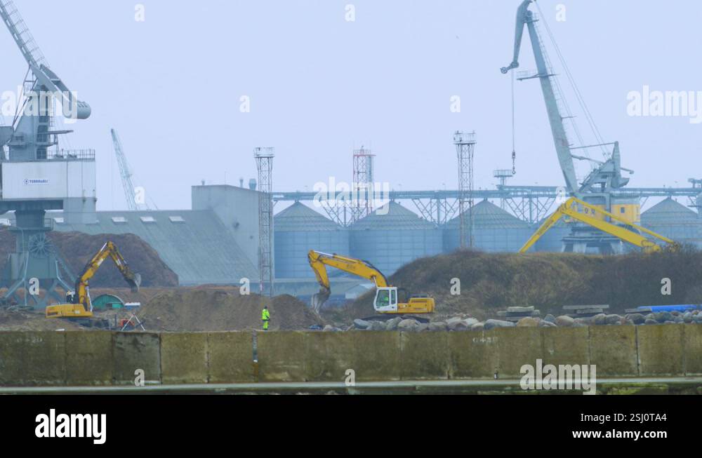 Distant view busy working port cranes at Port of Liepaja, large dry ...