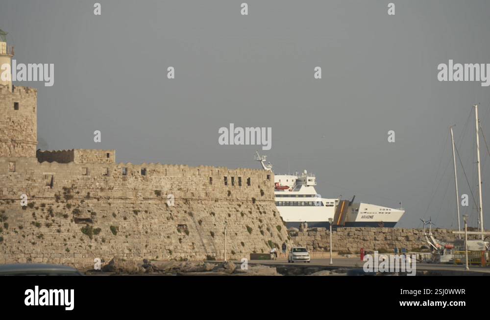Ferry passing Saint Nicholas Fortress, Mandraki Harbour, Rhodes Town ...
