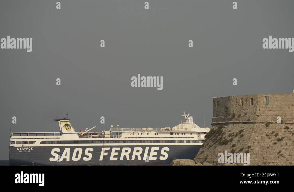 Ferry passing Saint Nicholas Fortress, Mandraki Harbour, Rhodes Town ...