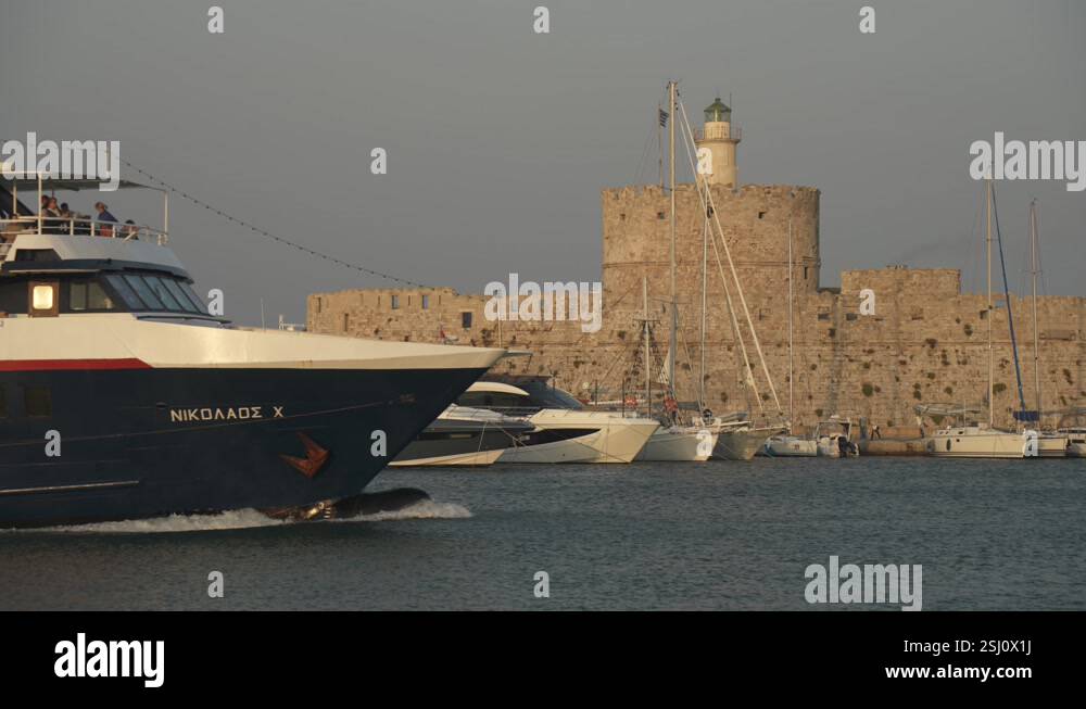 Ferry passing Saint Nicholas Fortress, Rhodes Town, Rhodes, Dodecanese ...