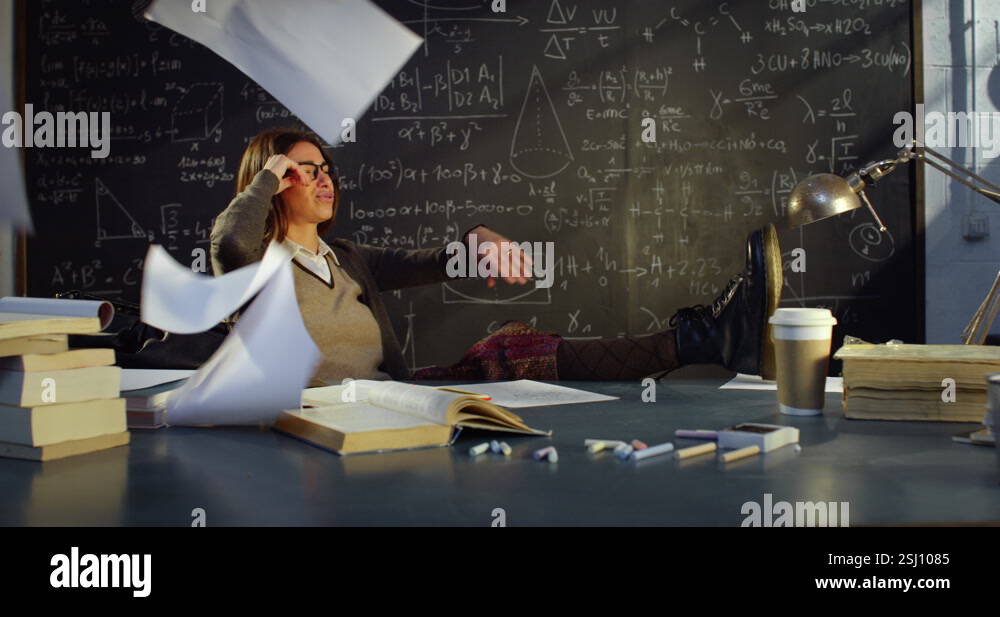 Woman in Classroom Throws the Papers Away and Takes a Break to Relax ...