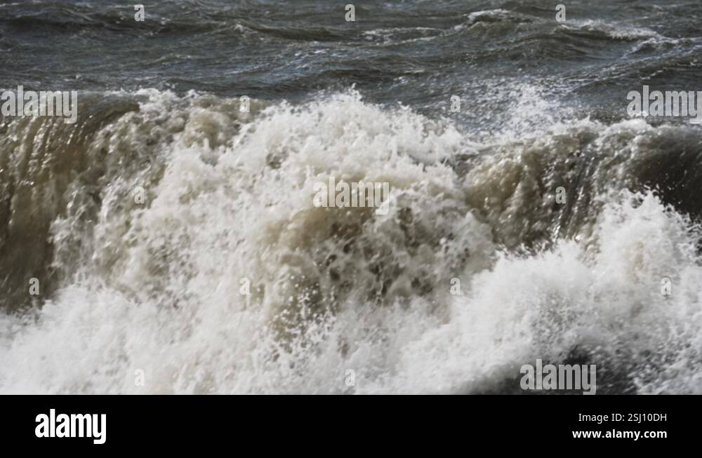 A stationary shot of strong waves in the middle of the sea near the ...