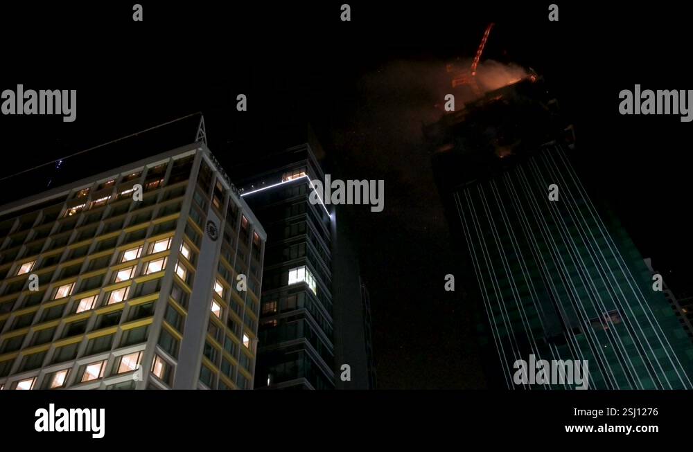 View of a fire incident affecting a high-rise skyscraper office ...