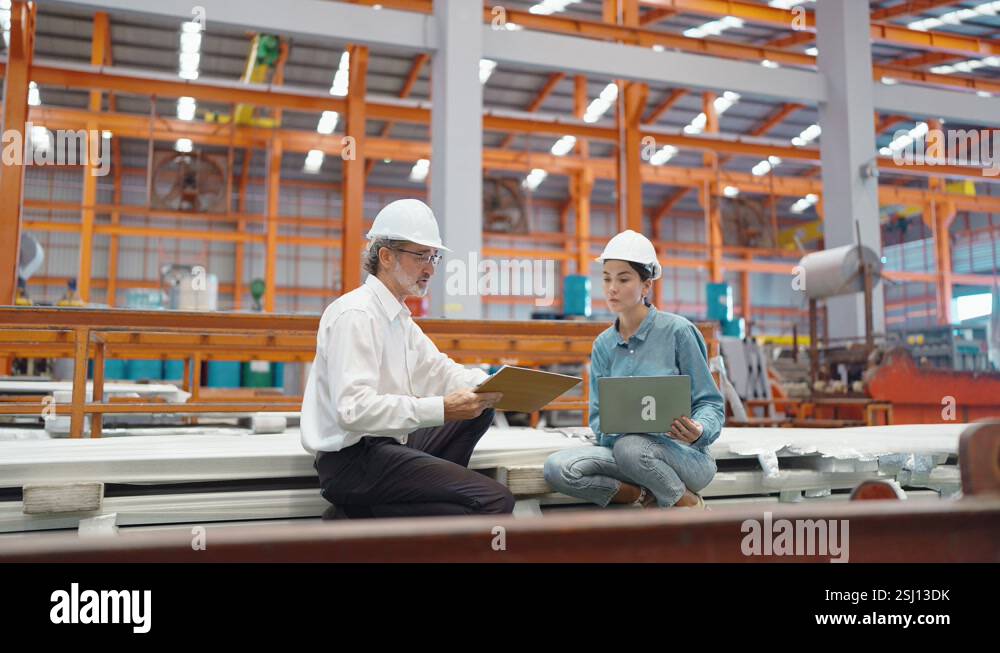 Two engineer manager leader and woman assistant holding laptop and ...