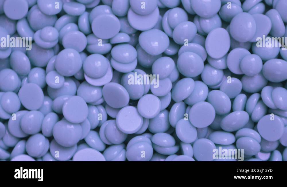 Wax granules for depilation. Background wax texture. Rotation. View ...