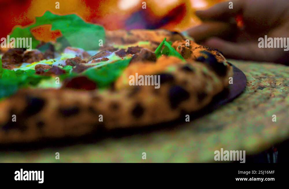 take a slice of pizza with the wood fire in the background Stock Video ...