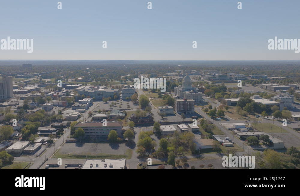 Aerial Panning Shot Of The Capitol Building Amidst Residential ...