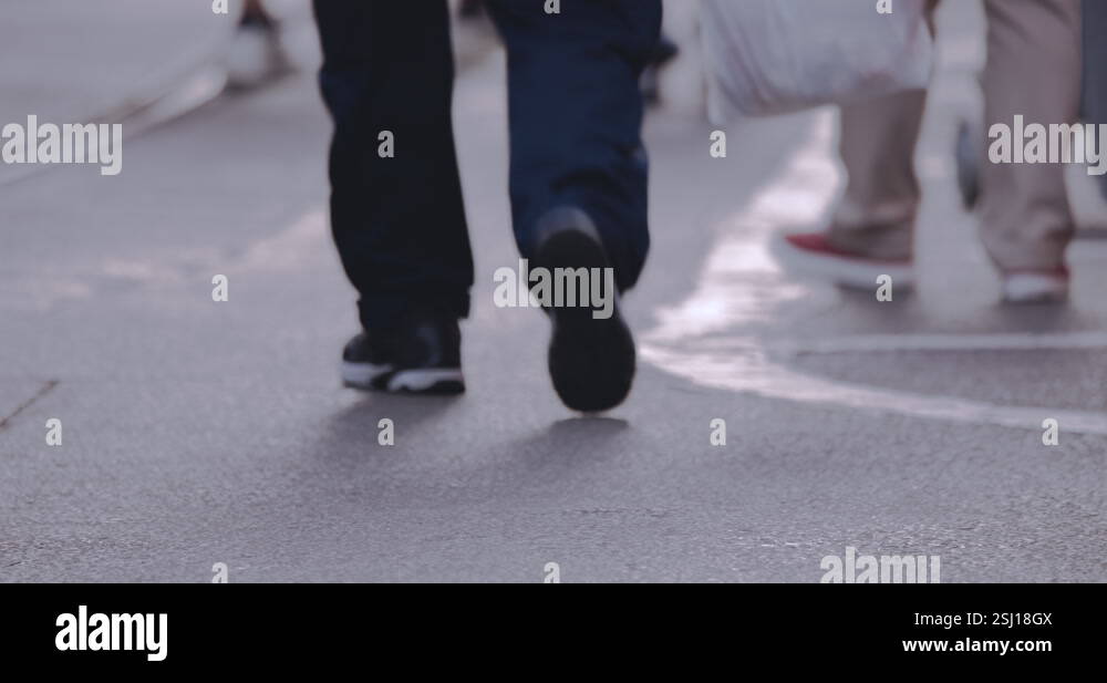 Pedestrians' Feet On A Busy Street Stock Video Footage - Alamy