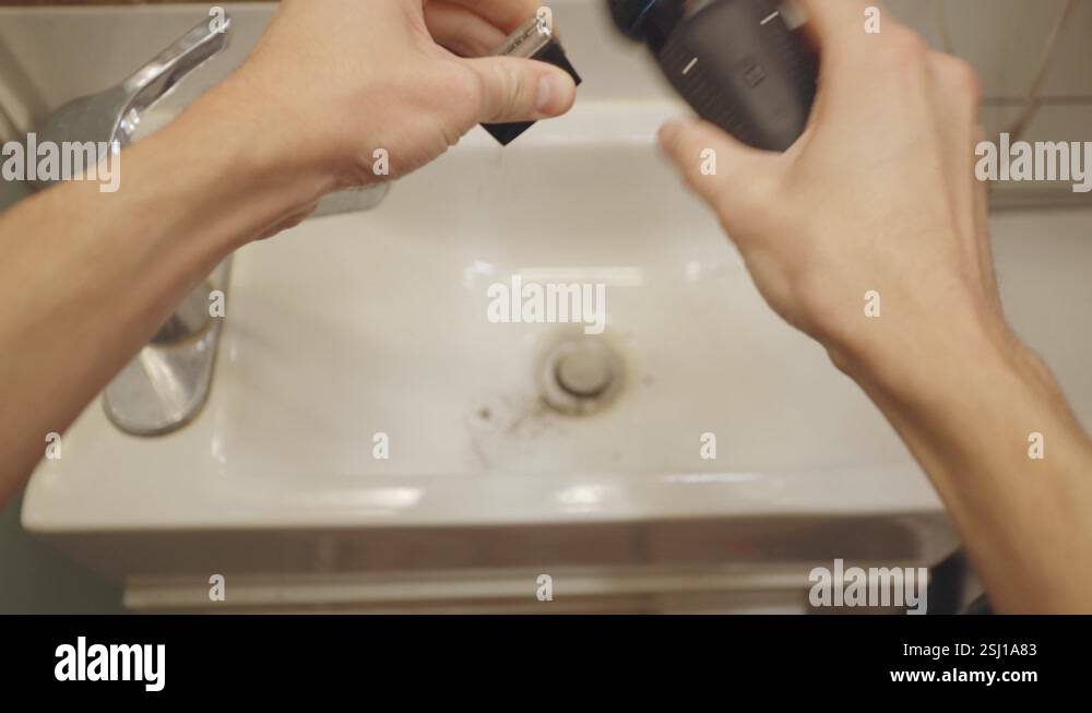 Male Hands Opening Cover Of An Electric Razor And Remove Bit Of Hair In ...