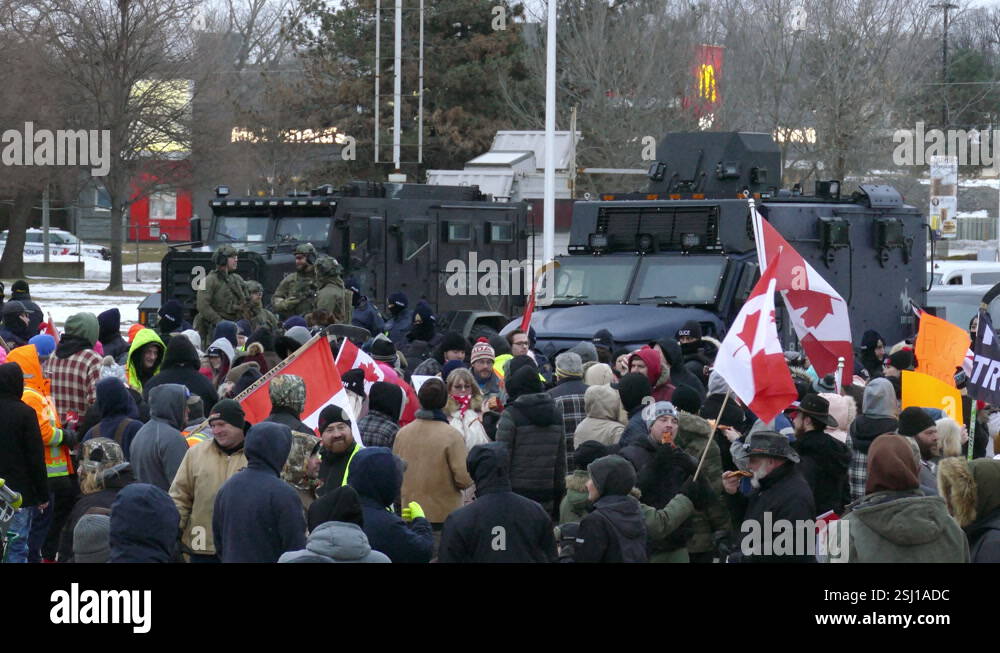 Freedom Convoy in Windsor, Crowd Waving Canadian Flags, Ontario, Canada ...