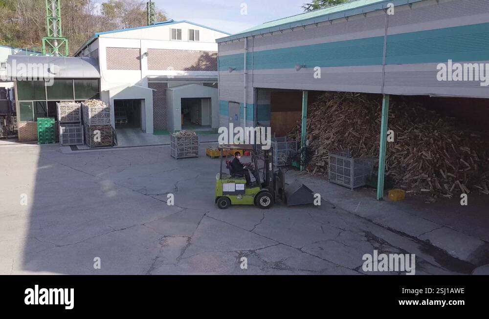 Worker driving a forklift truck at Hamyang County Bamboo Salt ...