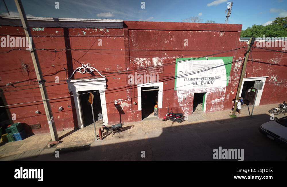 Panning view from above of a typical street in the small town of Motul ...