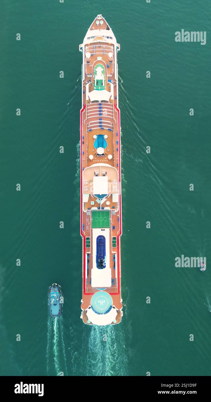 Flying over an empty cruise ship that is at sea. Vertical Top down ...