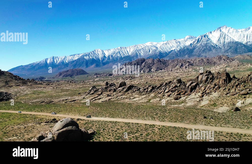 Aerial Panning Shot Of Pick-Up Truck And Off-Road Vehicle Moving On ...