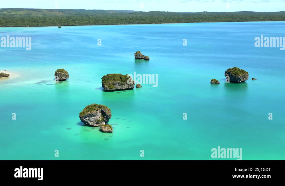 Aerial parallax around iconic floating rocks in famous Upi Bay, Isle of ...