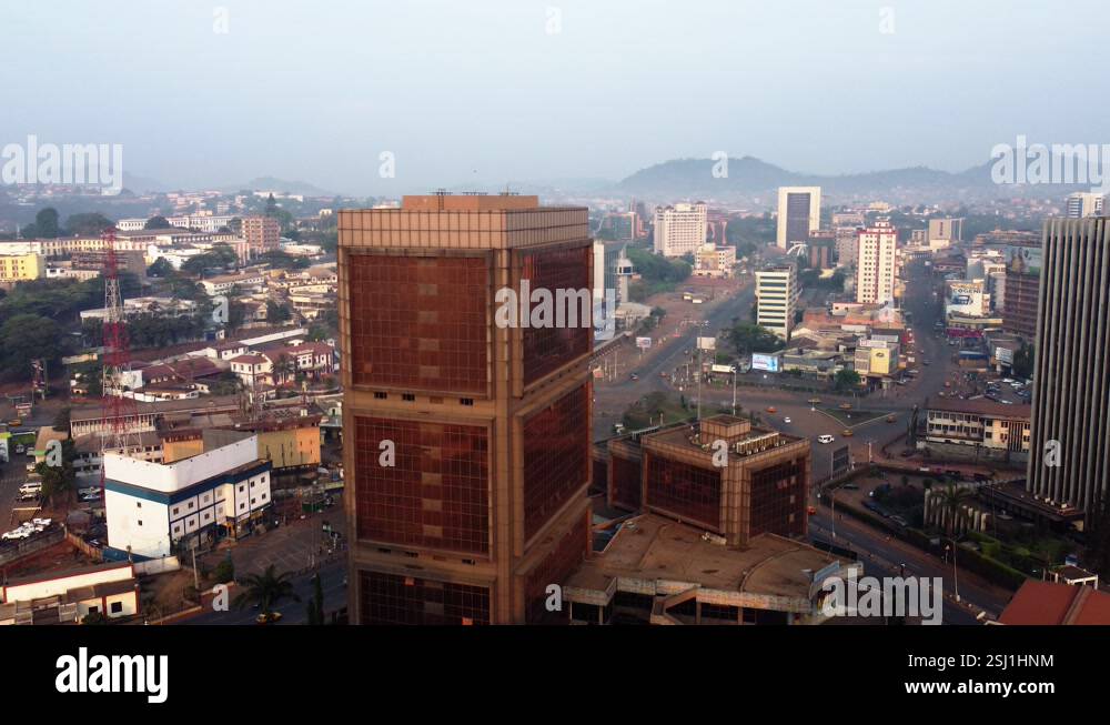 Aerial view rising around the Block number 2 building in sunny Yaounde ...