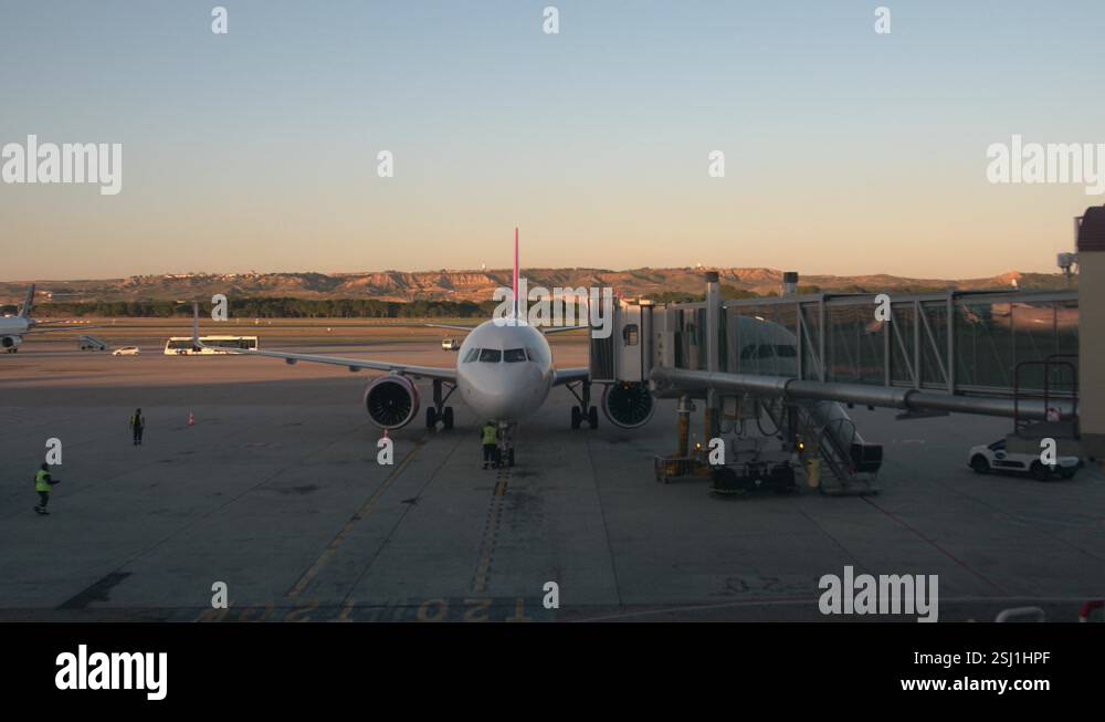 Airplane Landed and preparing to engage with the jet-bridge and ...