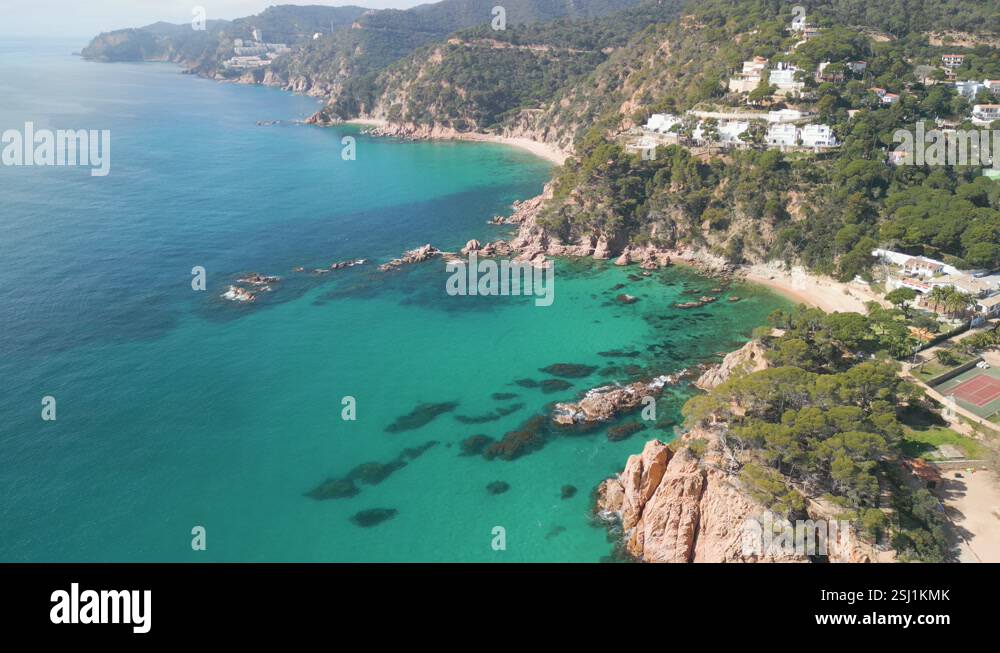 Small urban center that is located on the coast, surrounded by forests ...