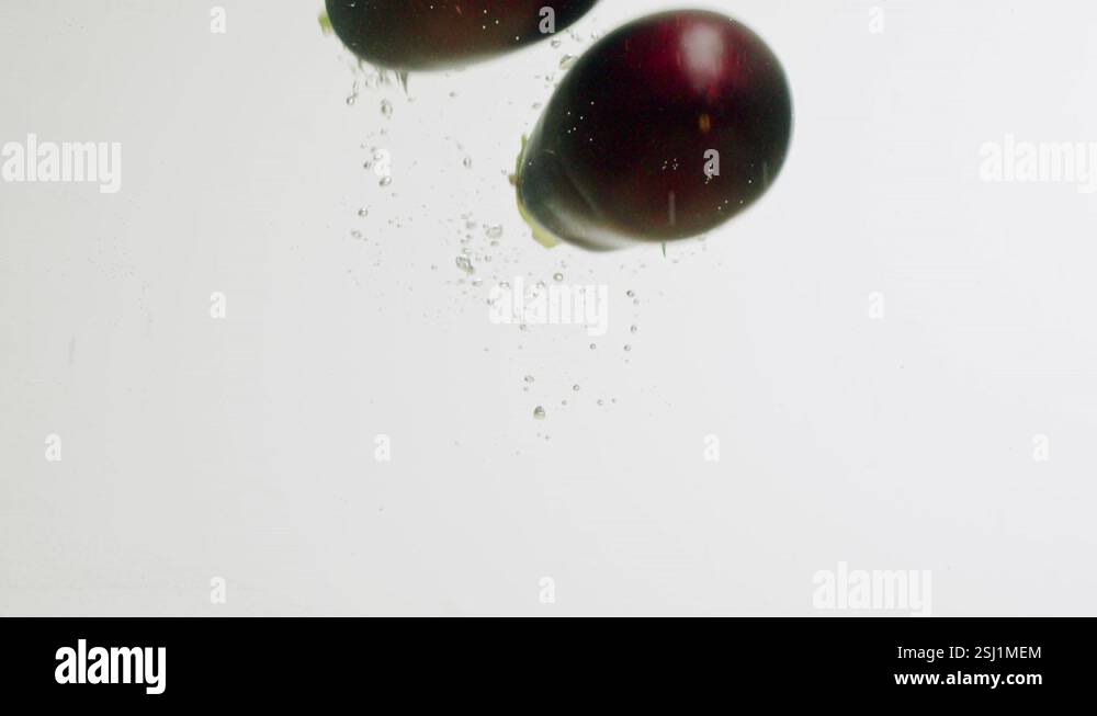 Eggplant vegetable dropping in pot, fresh fruits and vegetables falling ...