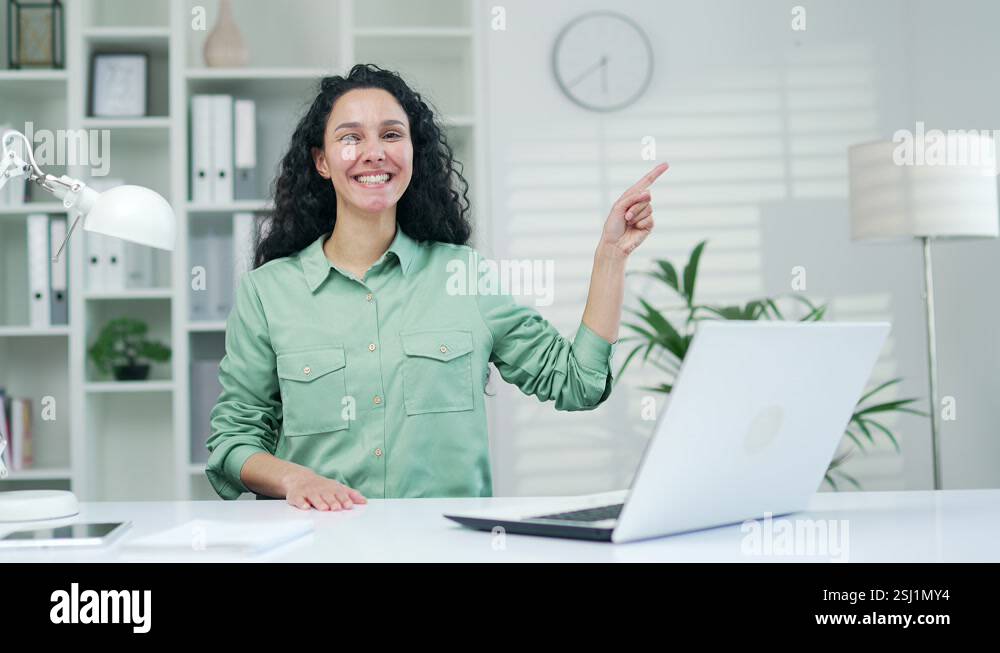 young female clerk employee freelance entrepreneur pointing finger at ...