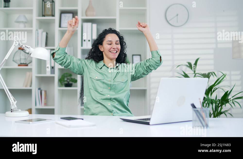 Happy joyful young hispanic woman office worker completed work on ...