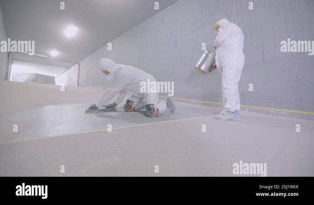 Builders make a paving on the parking lot. The process of creating a ...