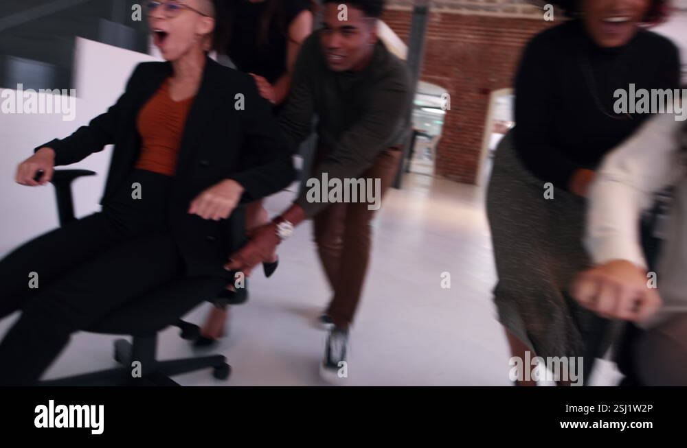 Business colleagues celebrate their success over a playful break in the ...