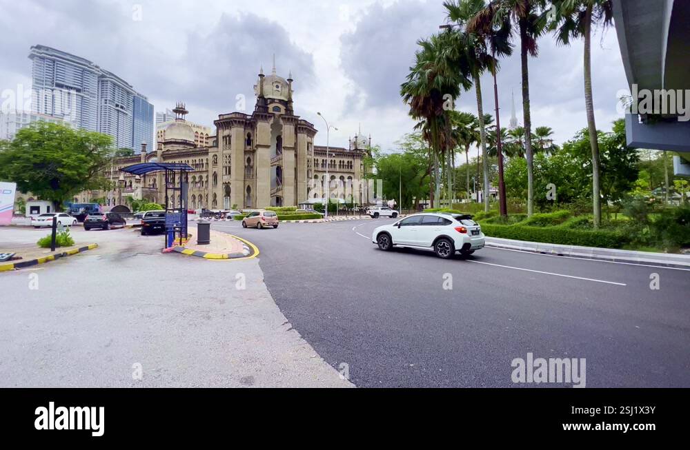 Busy traffic real city life on the most crowded crossroad in KL city ...