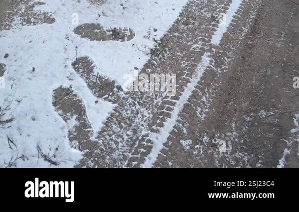 tire tracks in ice. tire tread marks on the ground. tire tread marks on ...