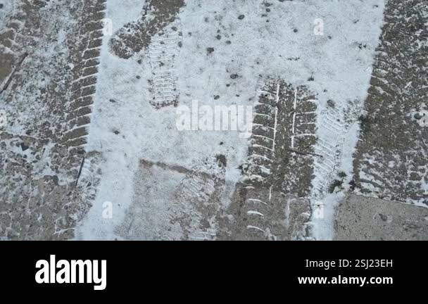 tire tracks in ice. tire tread marks on the ground. tire tread marks on ...