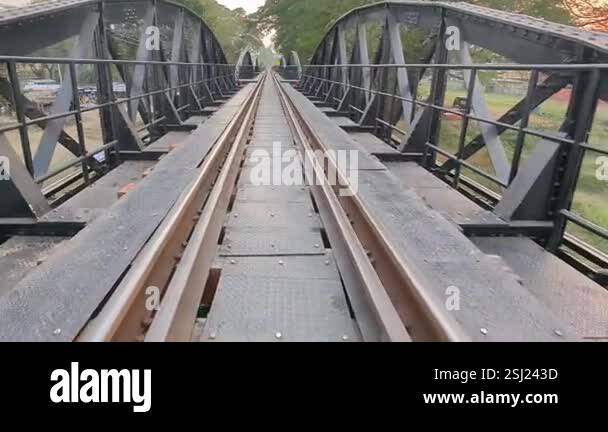 The River Kwai Bridge at sunset - Moving slowly across the famous ...