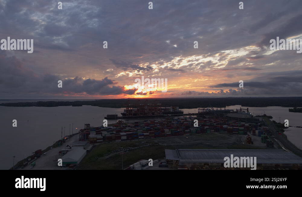aerial view of stunning hues of a sunset in the middle of clouds over ...