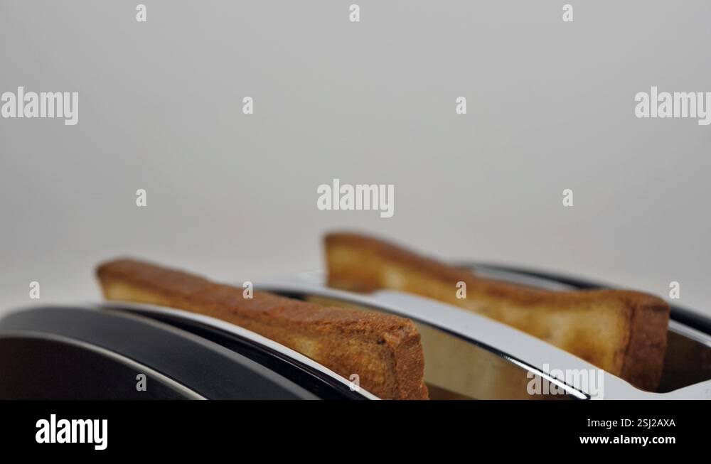 Fried toast bread pops out of a modern toaster, slow motion Stock Video Footage - Alamy
