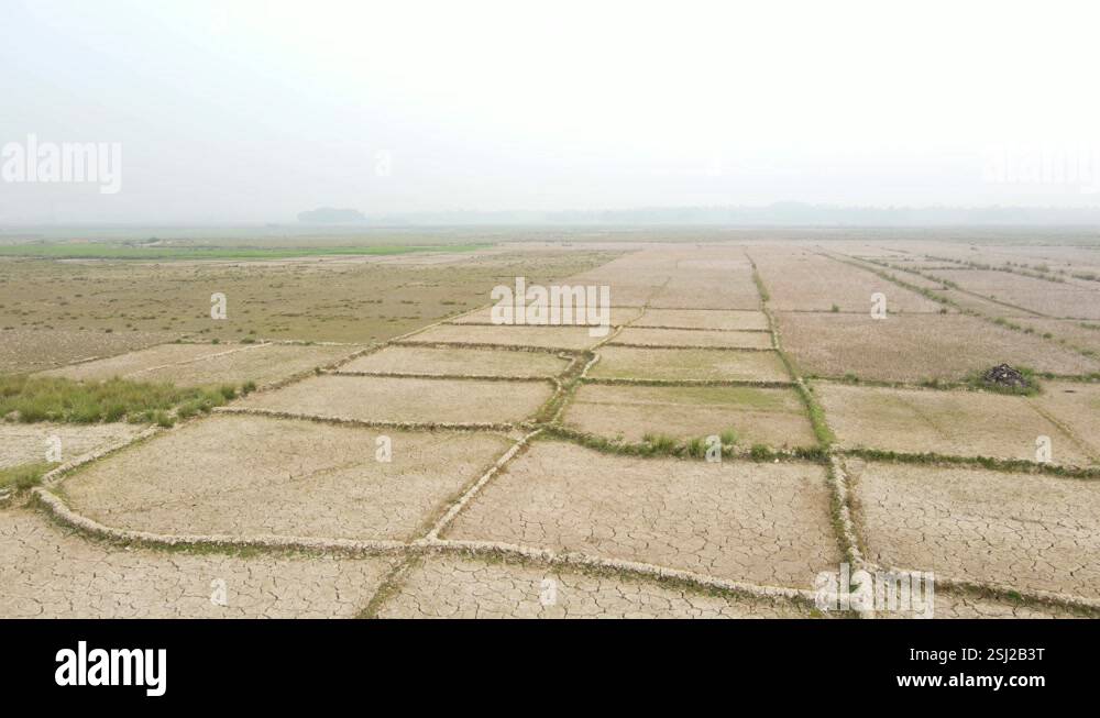 An aerial view of arid drought farmland on a farm in Bangladesh ...