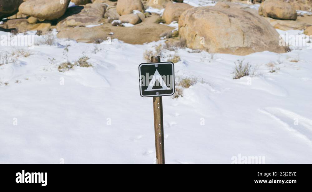 time lapse video of a camp post sign on a snow covered camp ground in ...